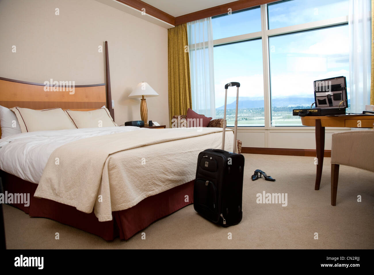 Hotel Room with Suitcase Stock Photo - Alamy