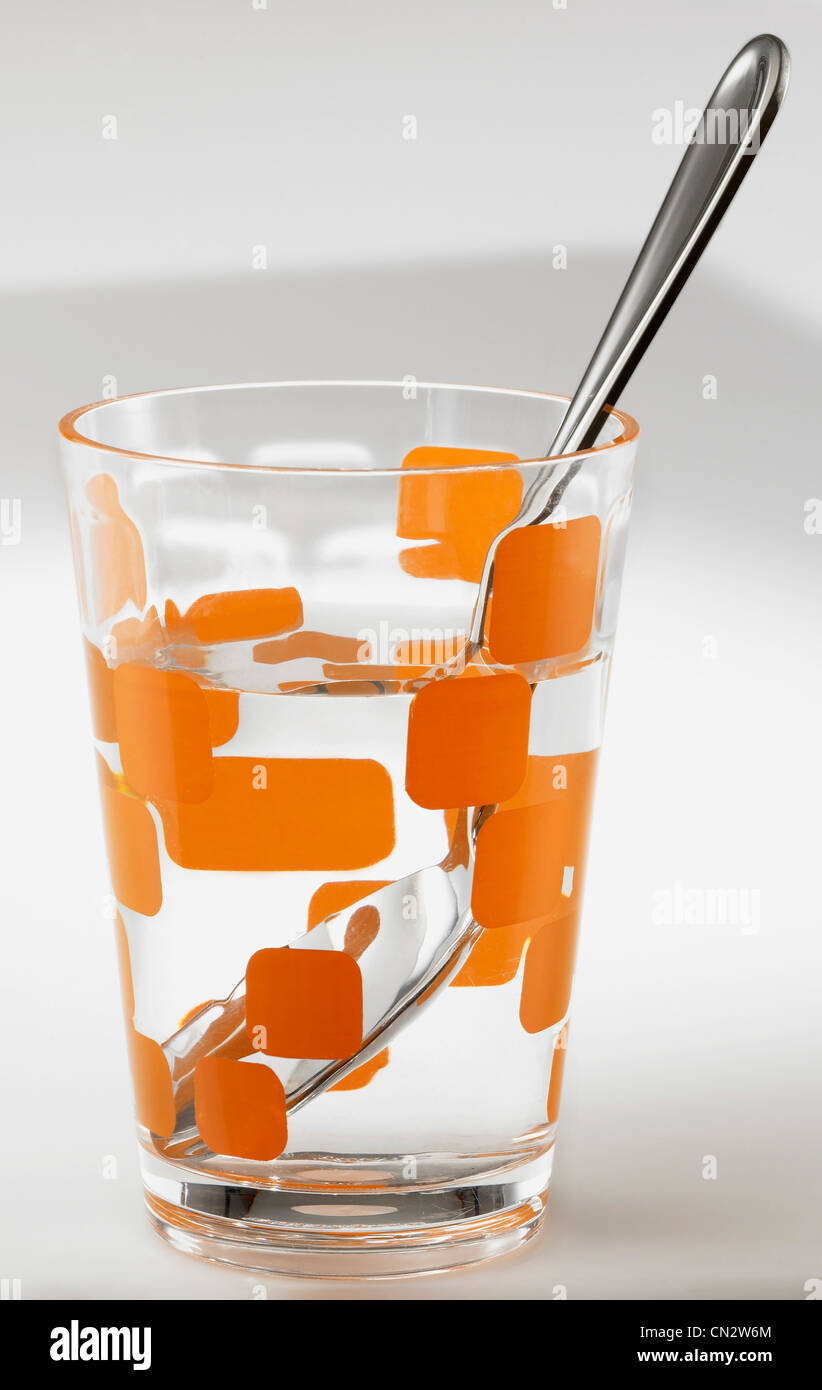 Glass of Water With Spoon Stock Photo - Alamy