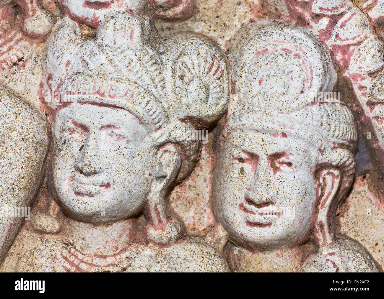 Native art carved on the wall in the temple Stock Photo - Alamy