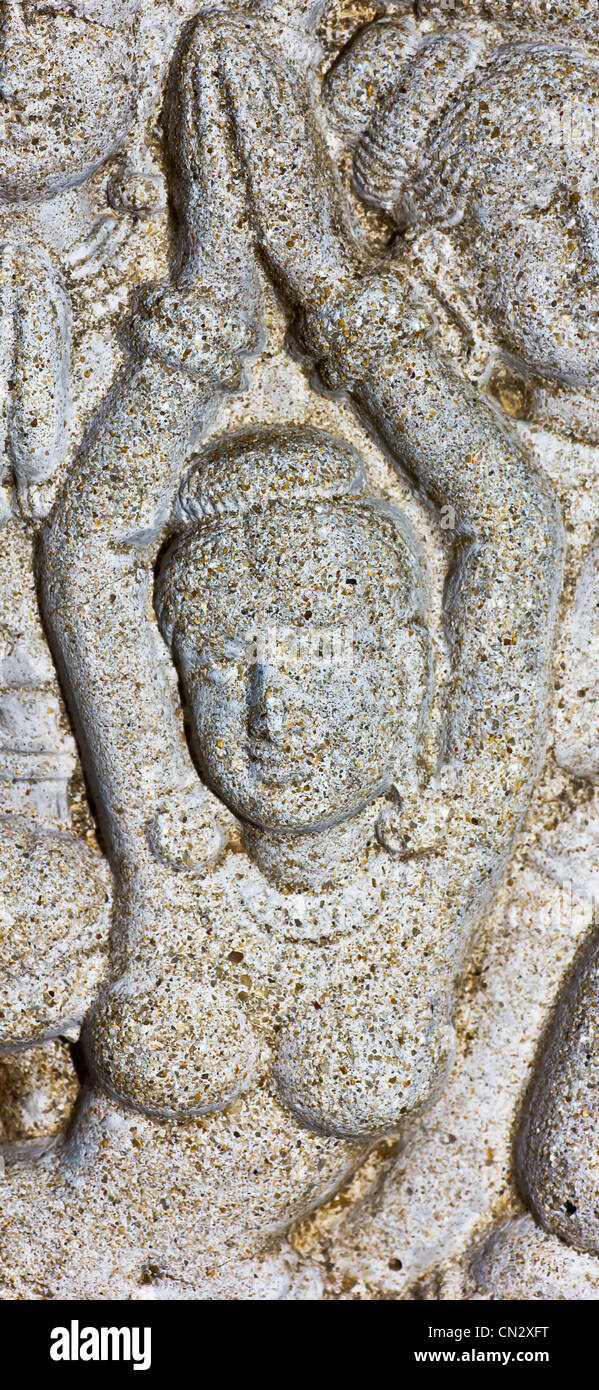 Native art carved on the wall in the temple Stock Photo - Alamy