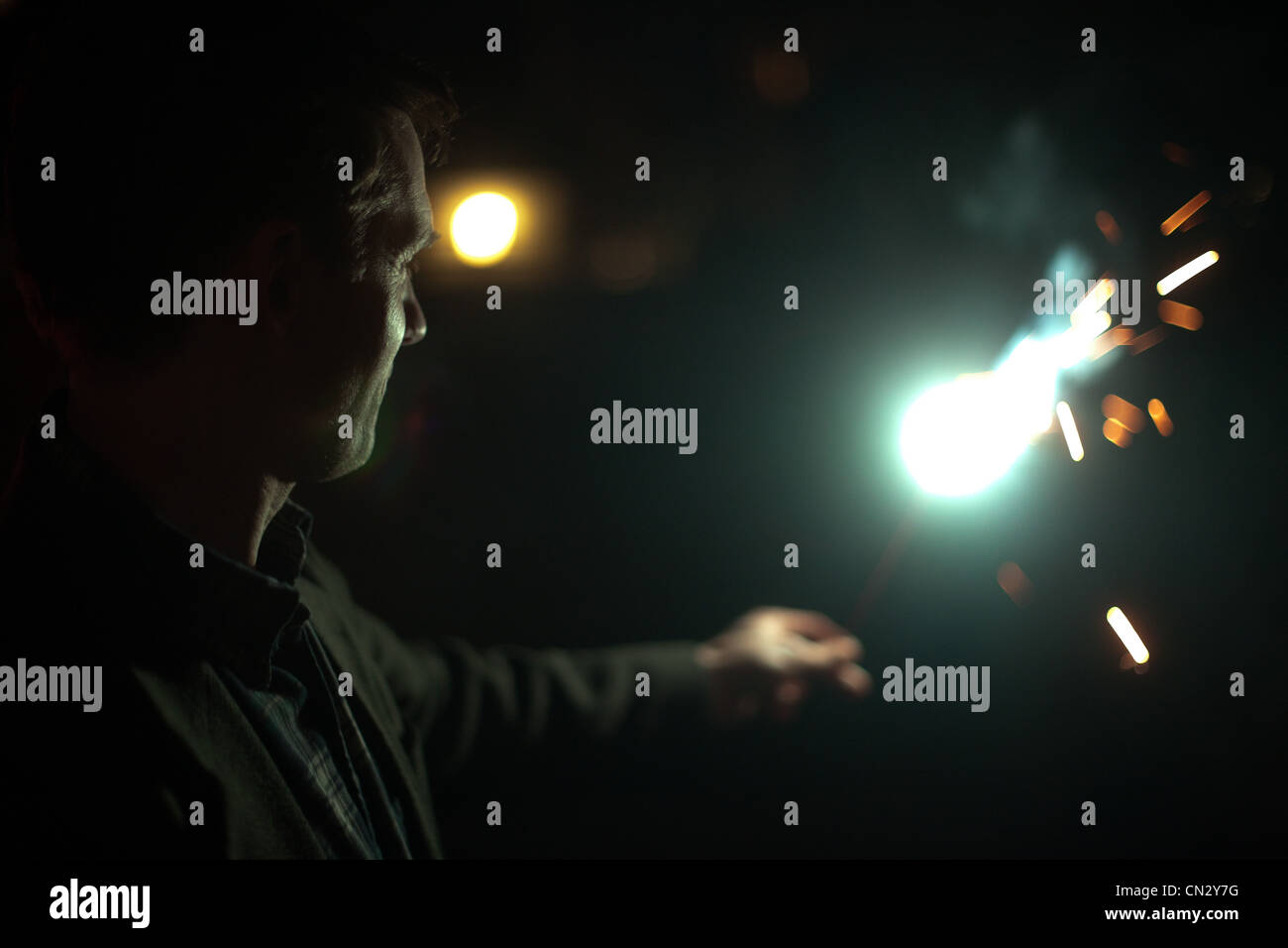 Man holding sparkler Stock Photo - Alamy
