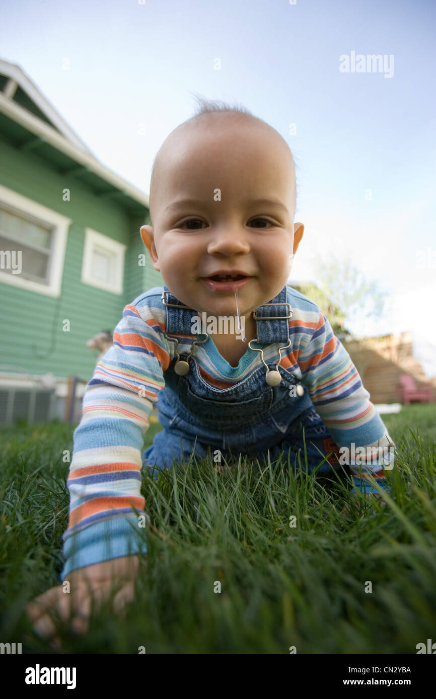 Young boy crawling on ground hi-res stock photography and images - Alamy