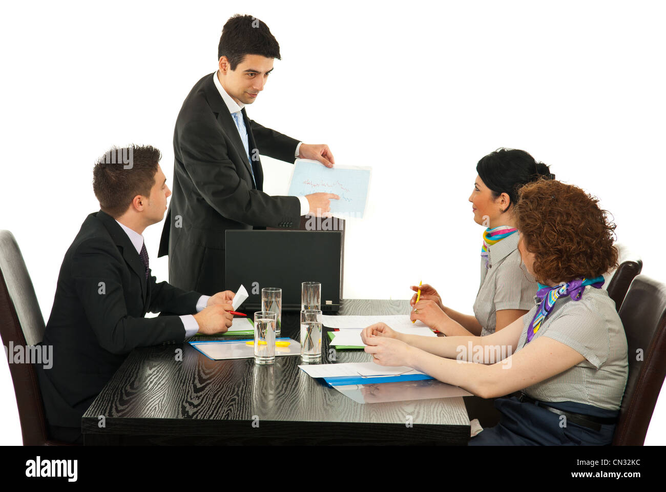 Manager showing diagram to his team at meeting against white background ...