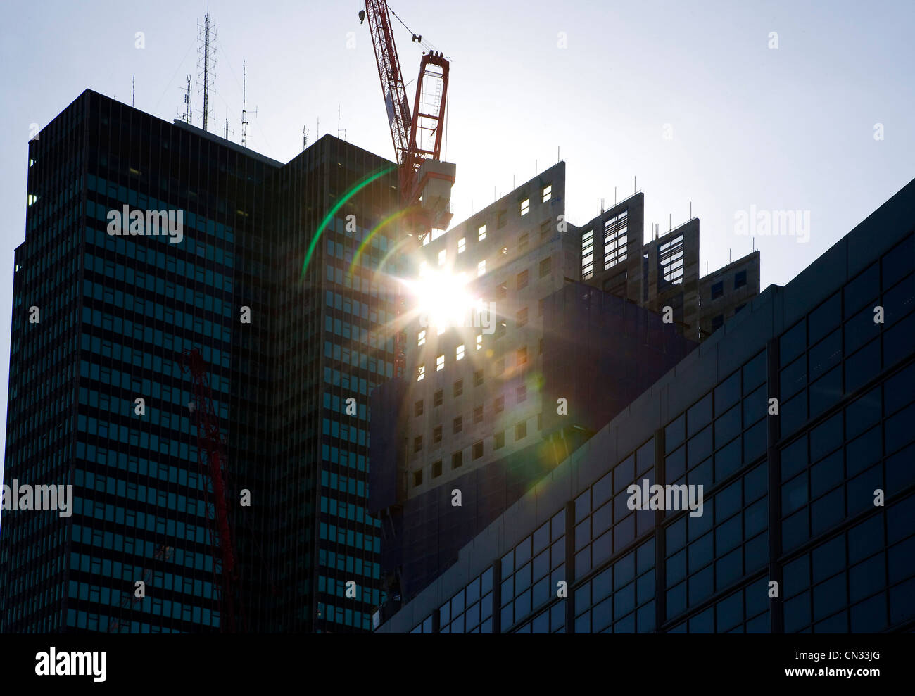 Sun shining through new building architecture Stock Photo - Alamy