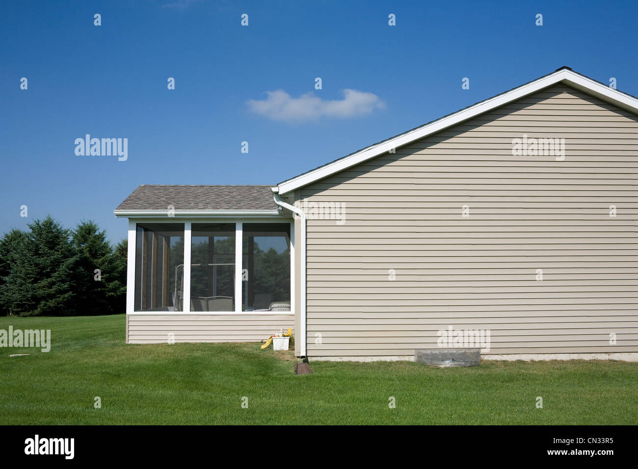 Side view of house with conservatory Stock Photo - Alamy
