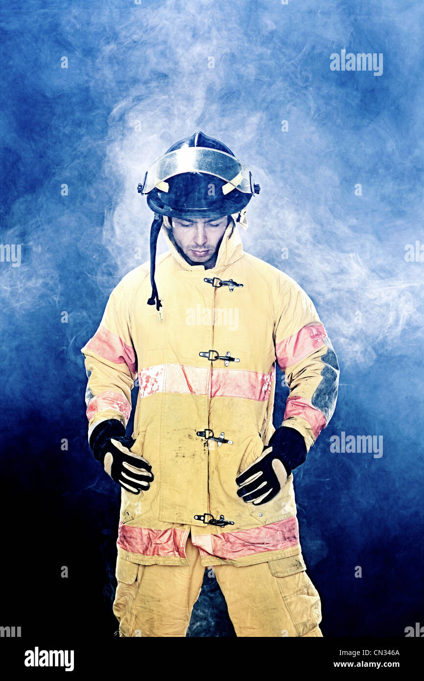 Portrait of firefighter in smoke Stock Photo - Alamy