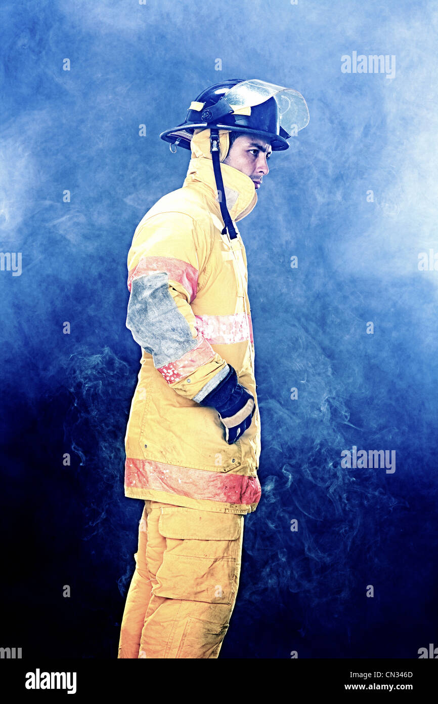 Portrait of firefighter in smoke Stock Photo - Alamy