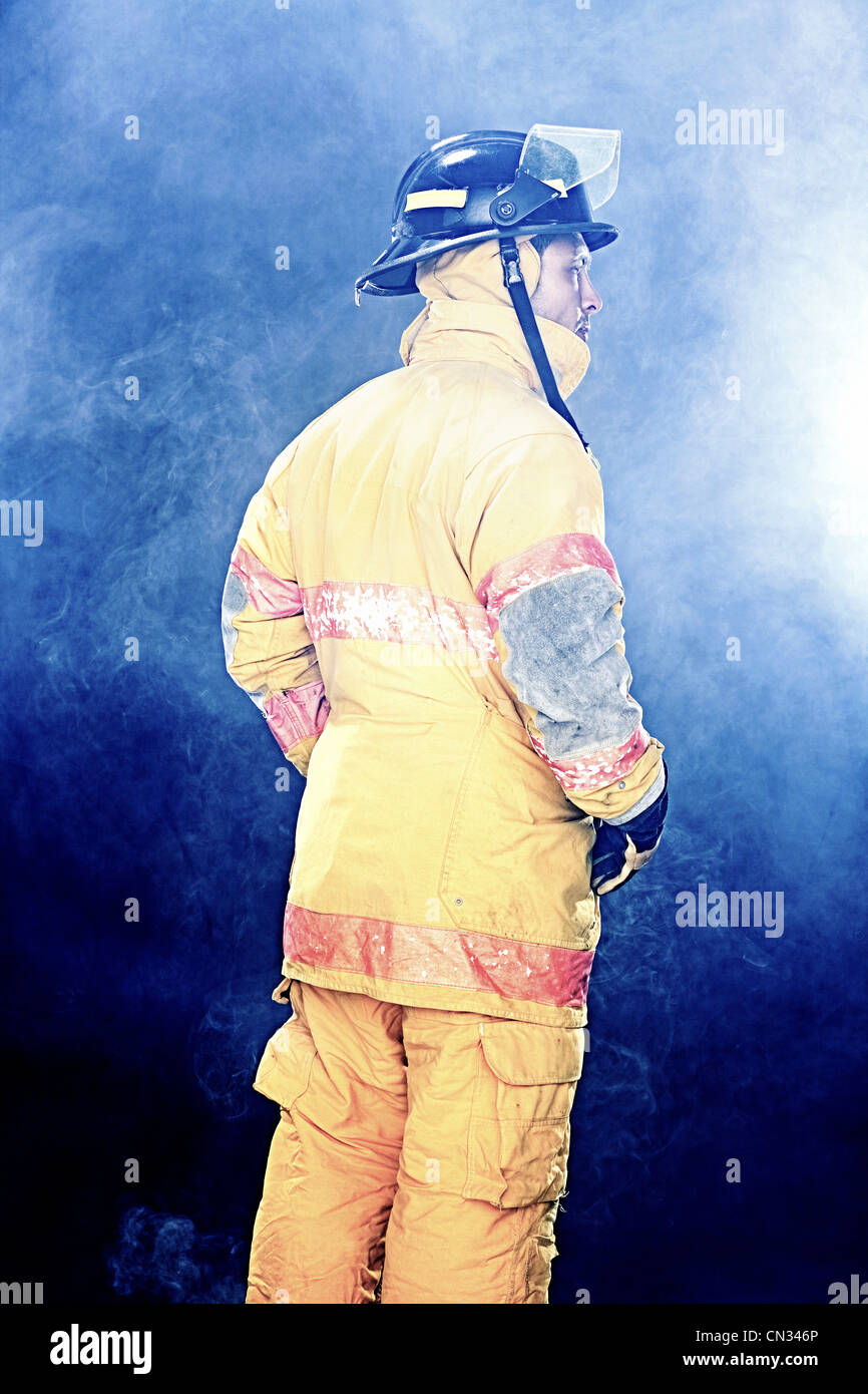 Portrait of firefighter in smoke Stock Photo - Alamy