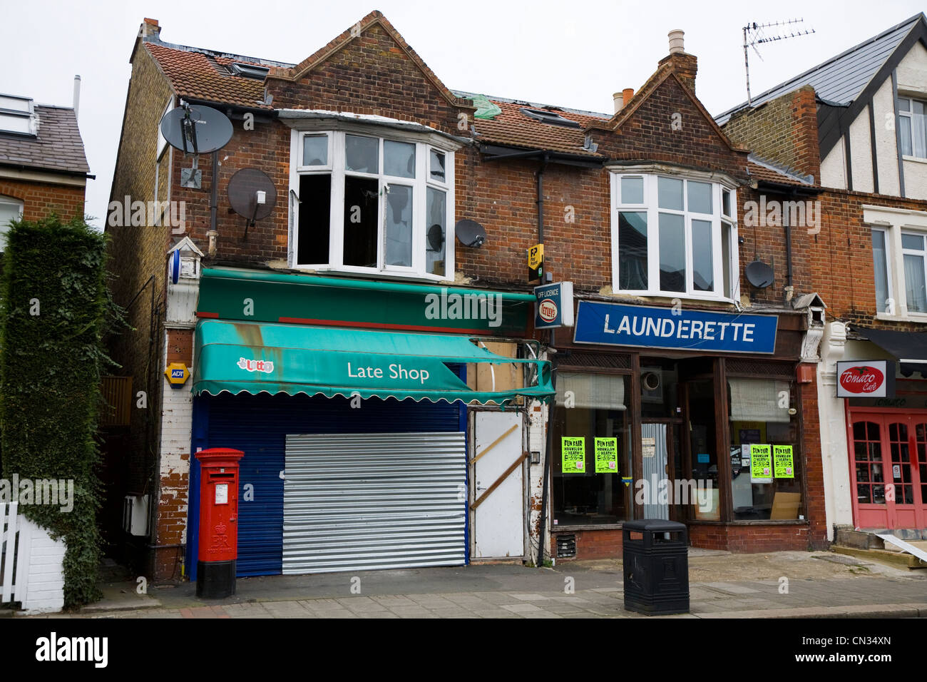Abandoned and boarded up / closed shut-up derelict shops (GPO Post ...
