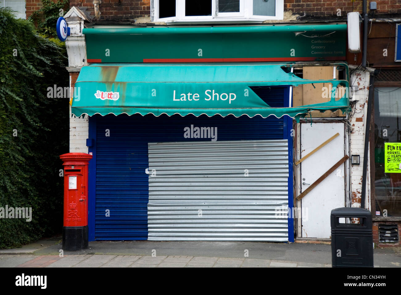 Abandoned and boarded up / closed / shut-up derelict shop (former GPO ...