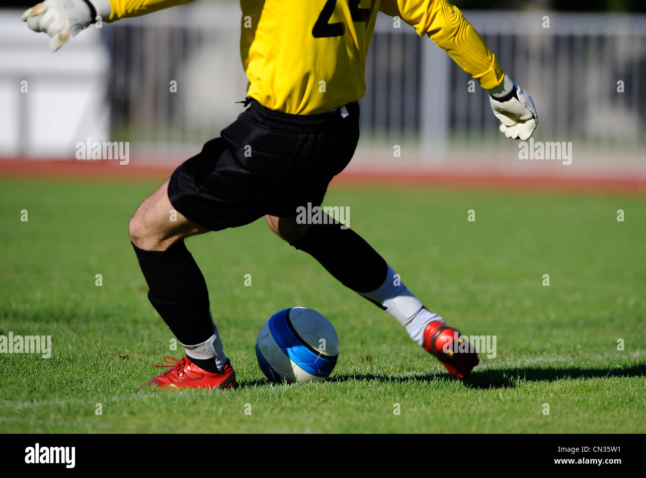 soccer or football goalkeeper kick the ball Stock Photo - Alamy