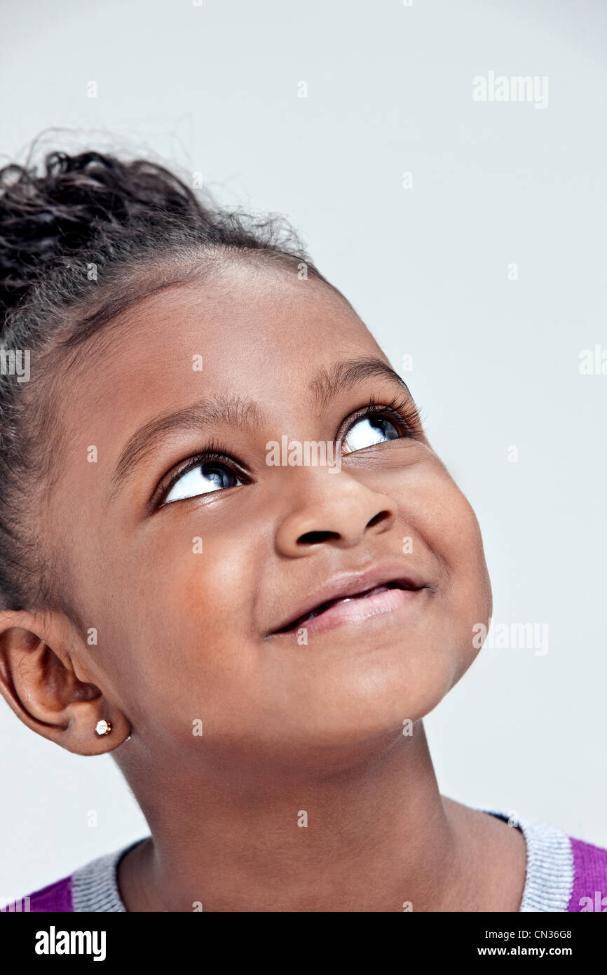 Girl smiling, looking up Stock Photo - Alamy