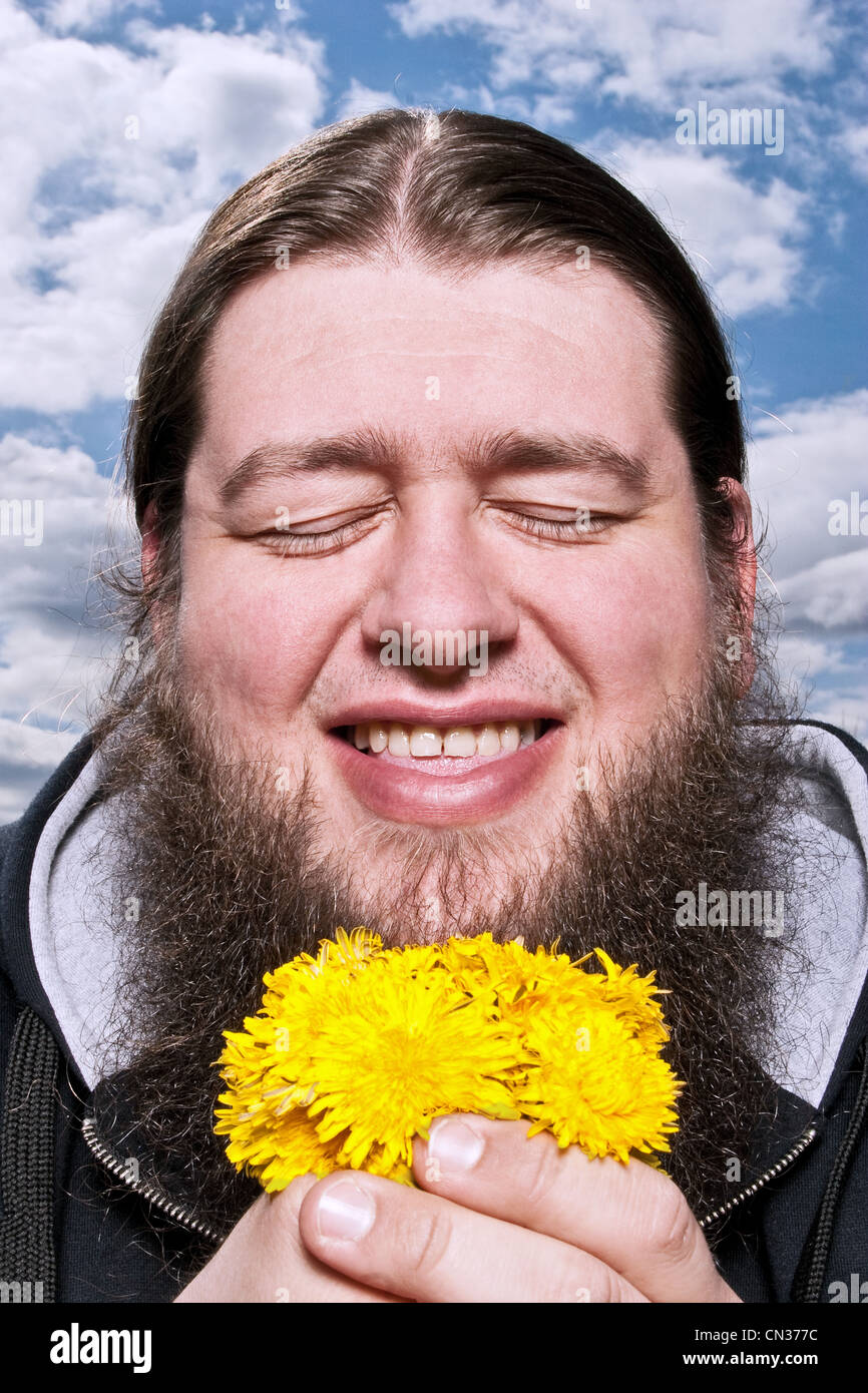 Happy bearded man with yellow flowers Stock Photo - Alamy Happy bearded man with yellow flowers Stock Photo - Alamy