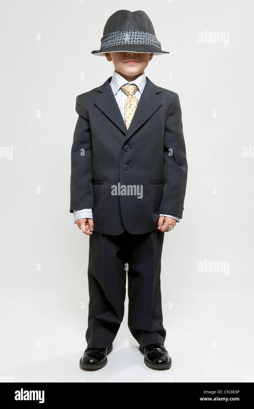 Boy wearing suit and fedora Stock Photo - Alamy