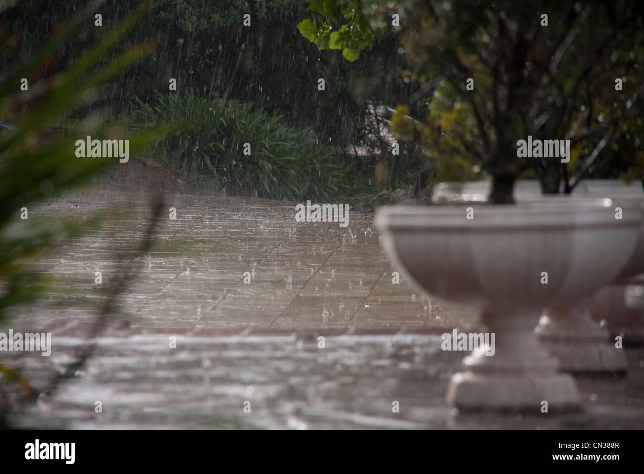 Heavy rain on the patio Stock Photo - Alamy
