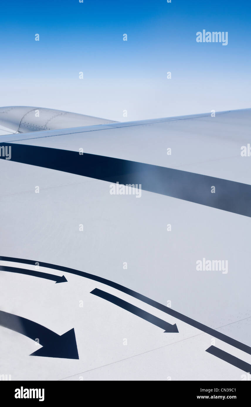Airplane wing seen with arrows Stock Photo - Alamy