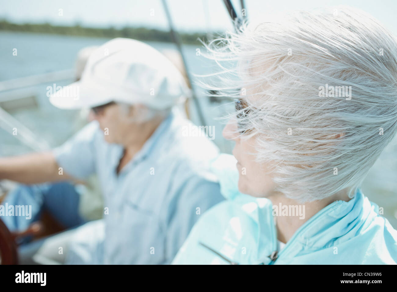 Woman on boat with wind in hair Stock Photo - Alamy