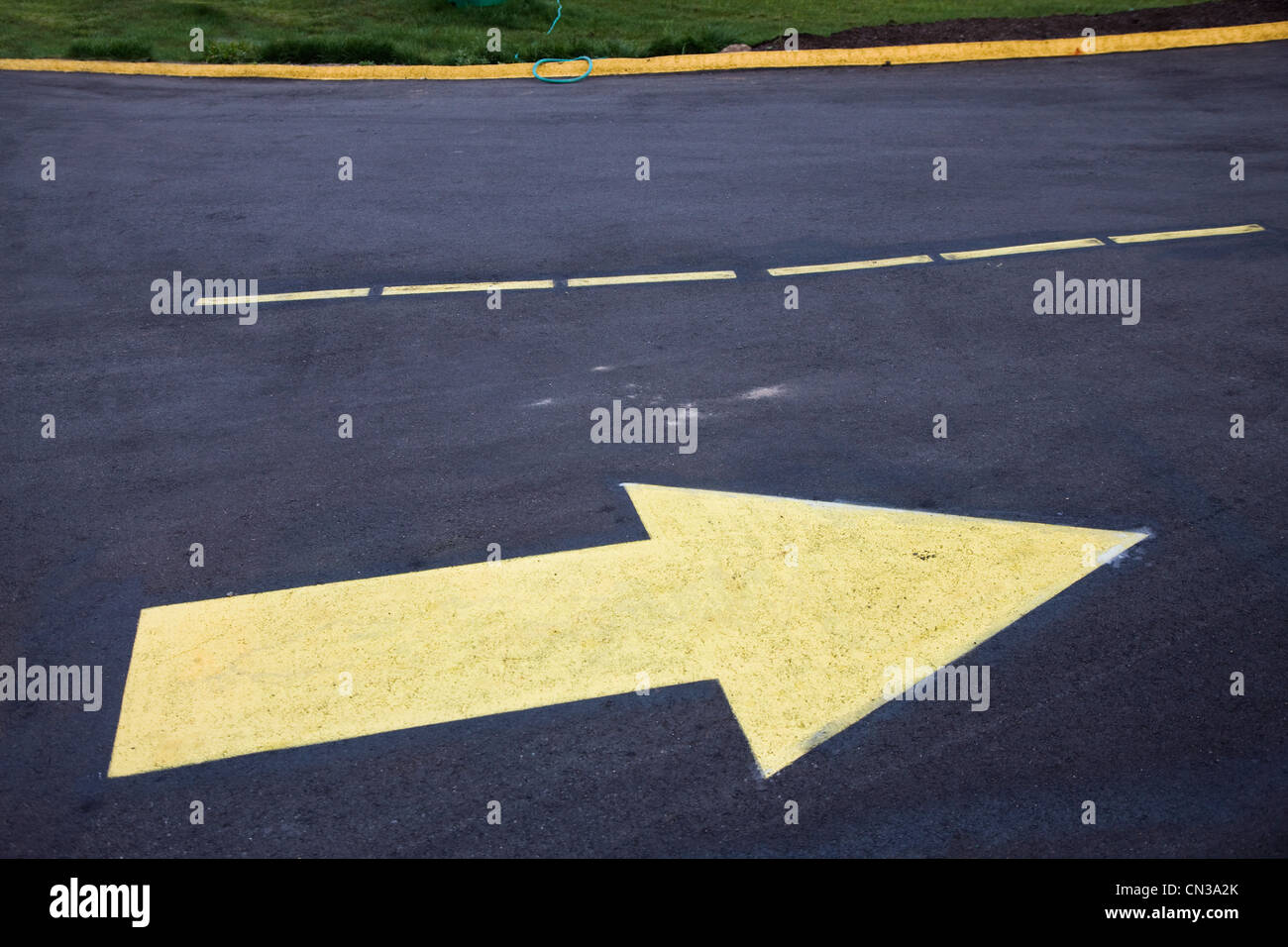 Arrow on road Stock Photo - Alamy