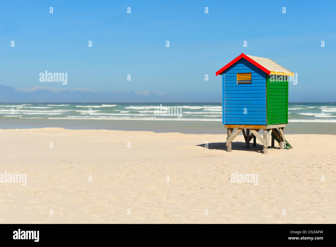Brightly colored beach hut on beach Stock Photo - Alamy