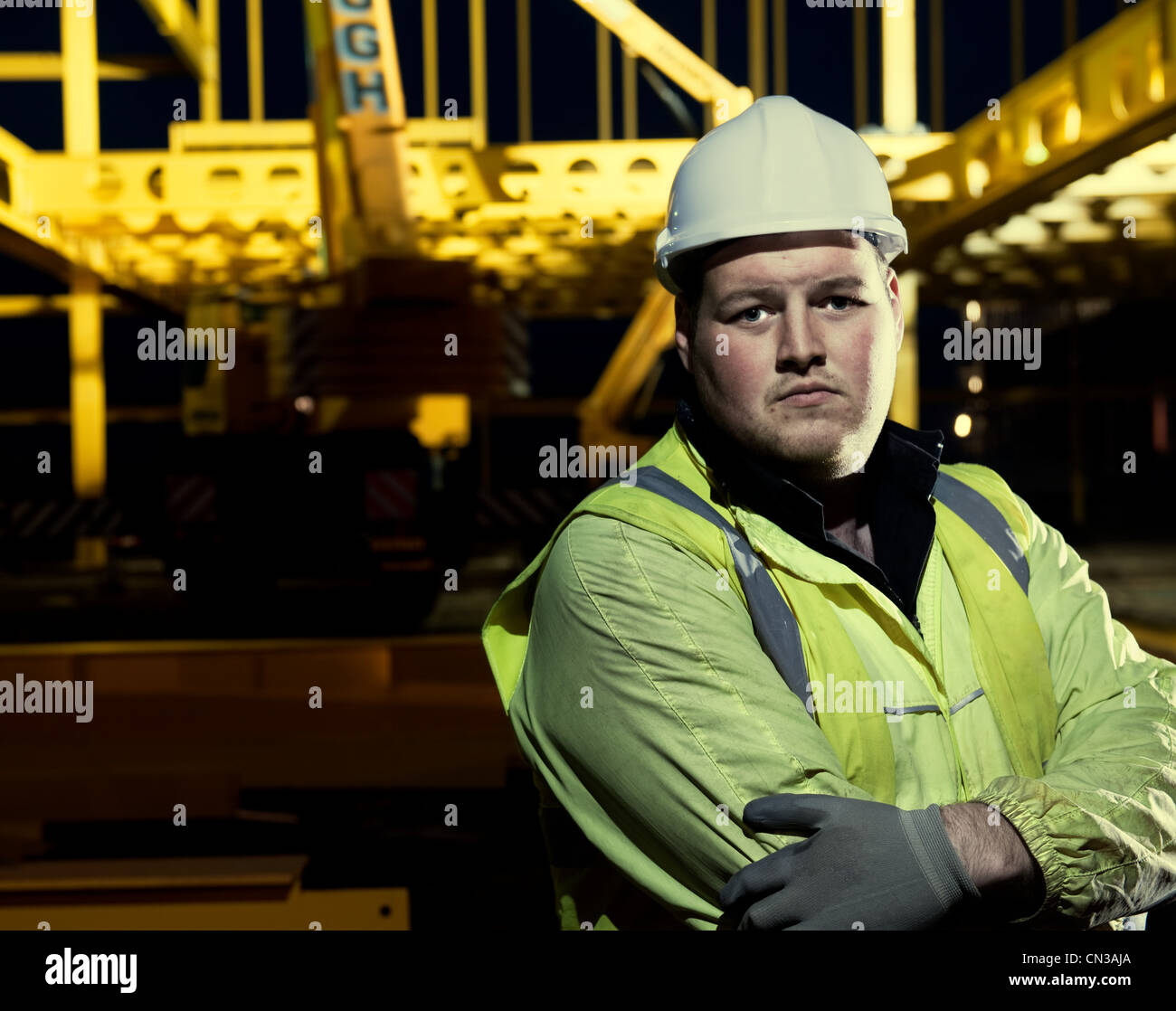 Portrait of builder on construction site Stock Photo - Alamy