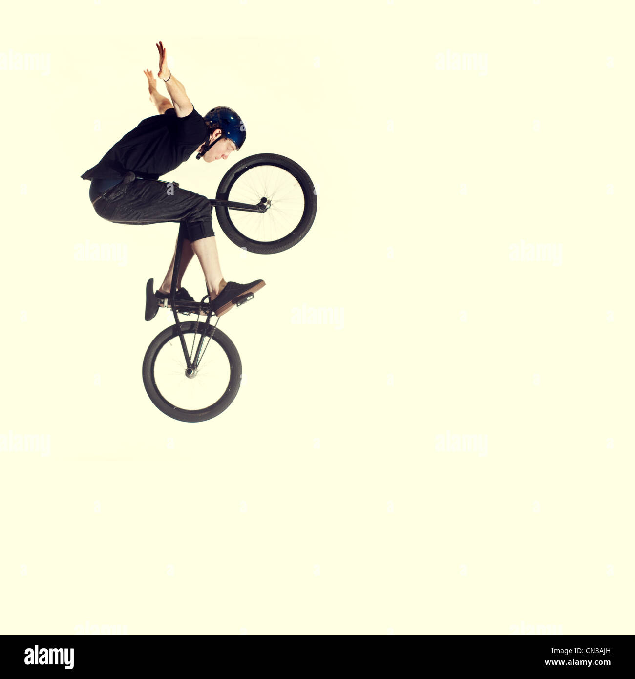 Young man on bmx bike, mid air Stock Photo - Alamy