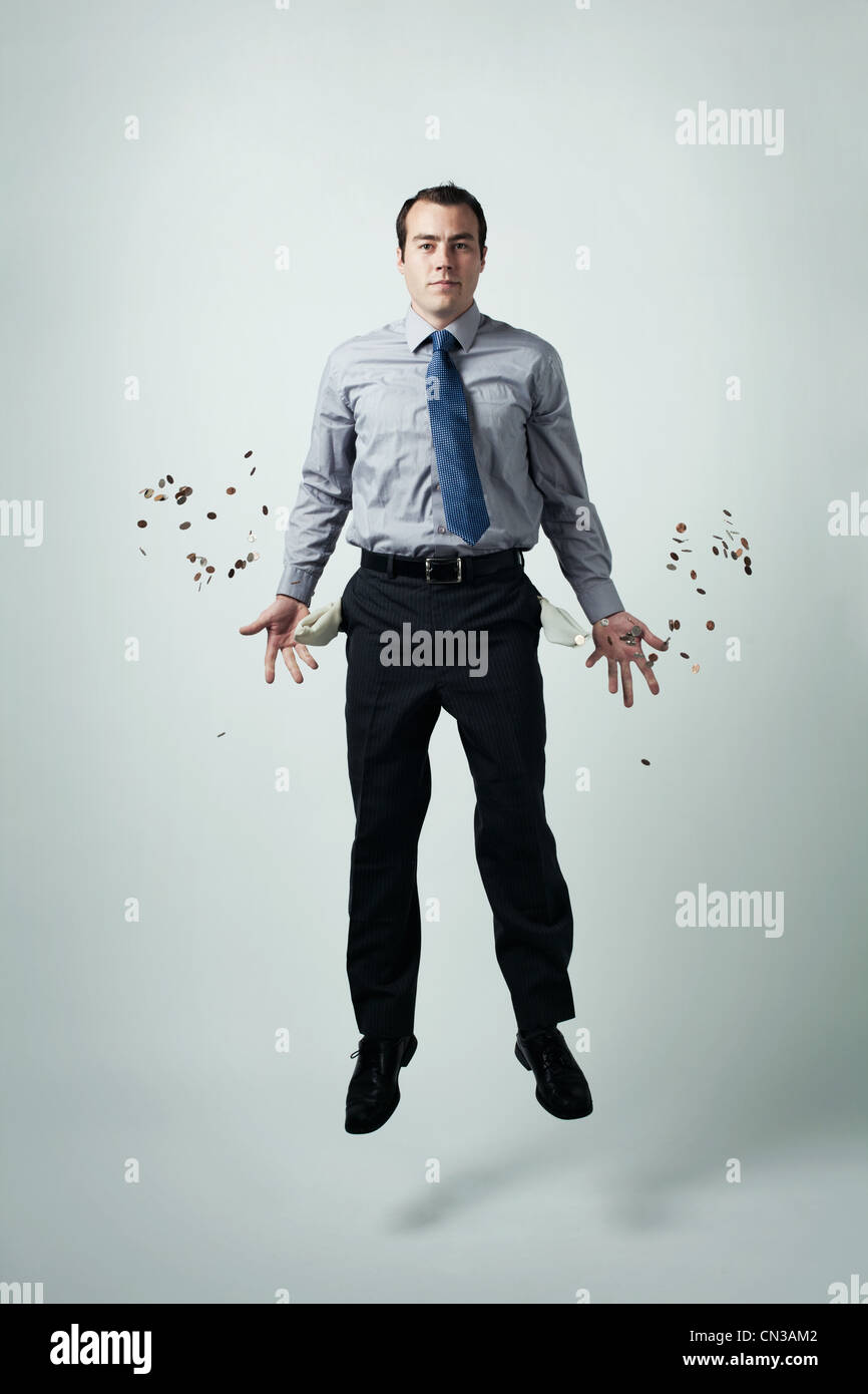 Money coming out pockets hi-res stock photography and images - Alamy