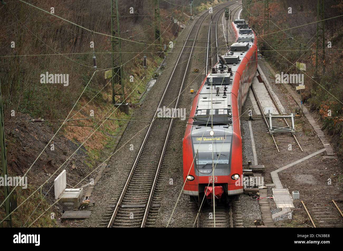 Local passenger train changing tracks Stock Photo - Alamy