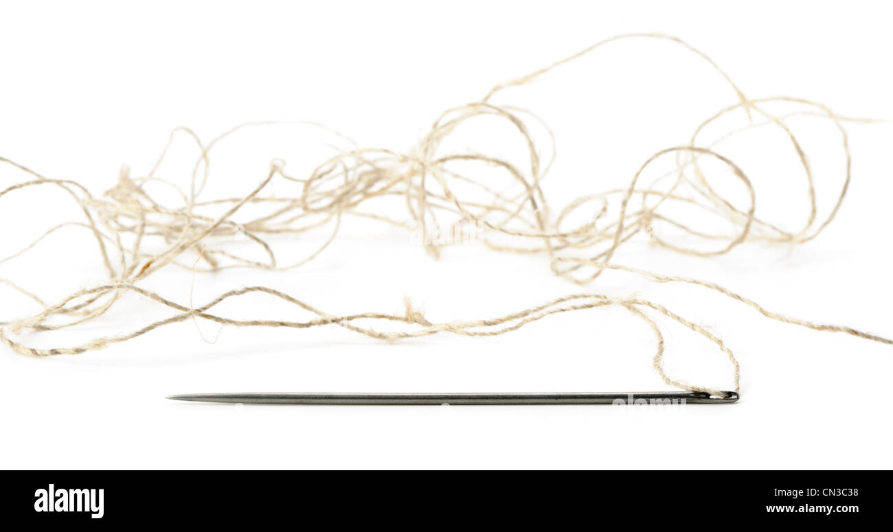 Needle and thread closeup. Isolated on white background Stock Photo - Alamy