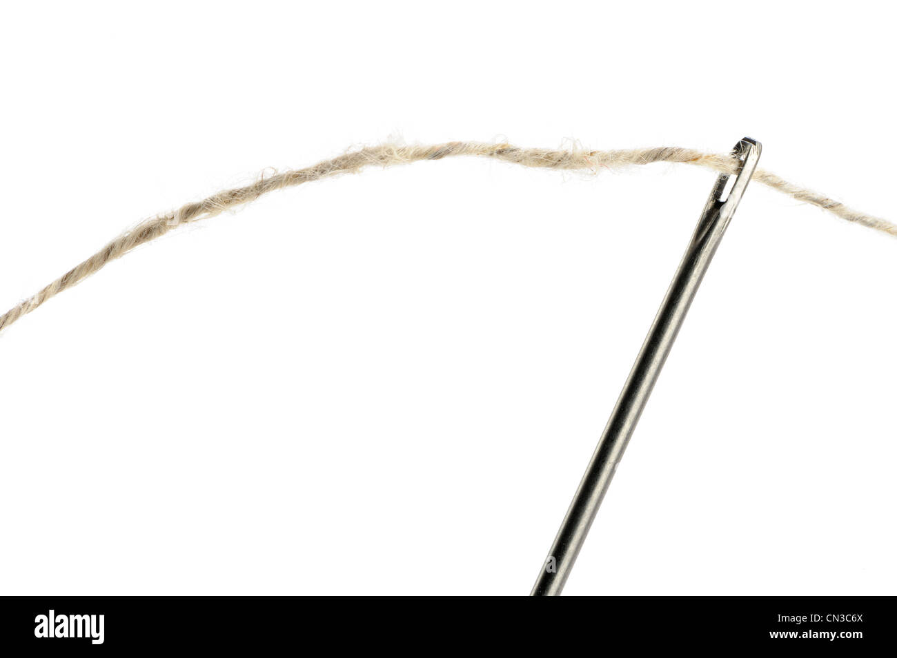 Needle and thread closeup. Isolated on white background Stock Photo - Alamy