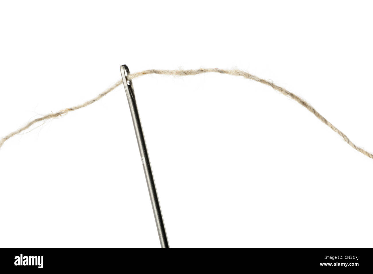 Needle and thread closeup. Isolated on white background Stock Photo - Alamy