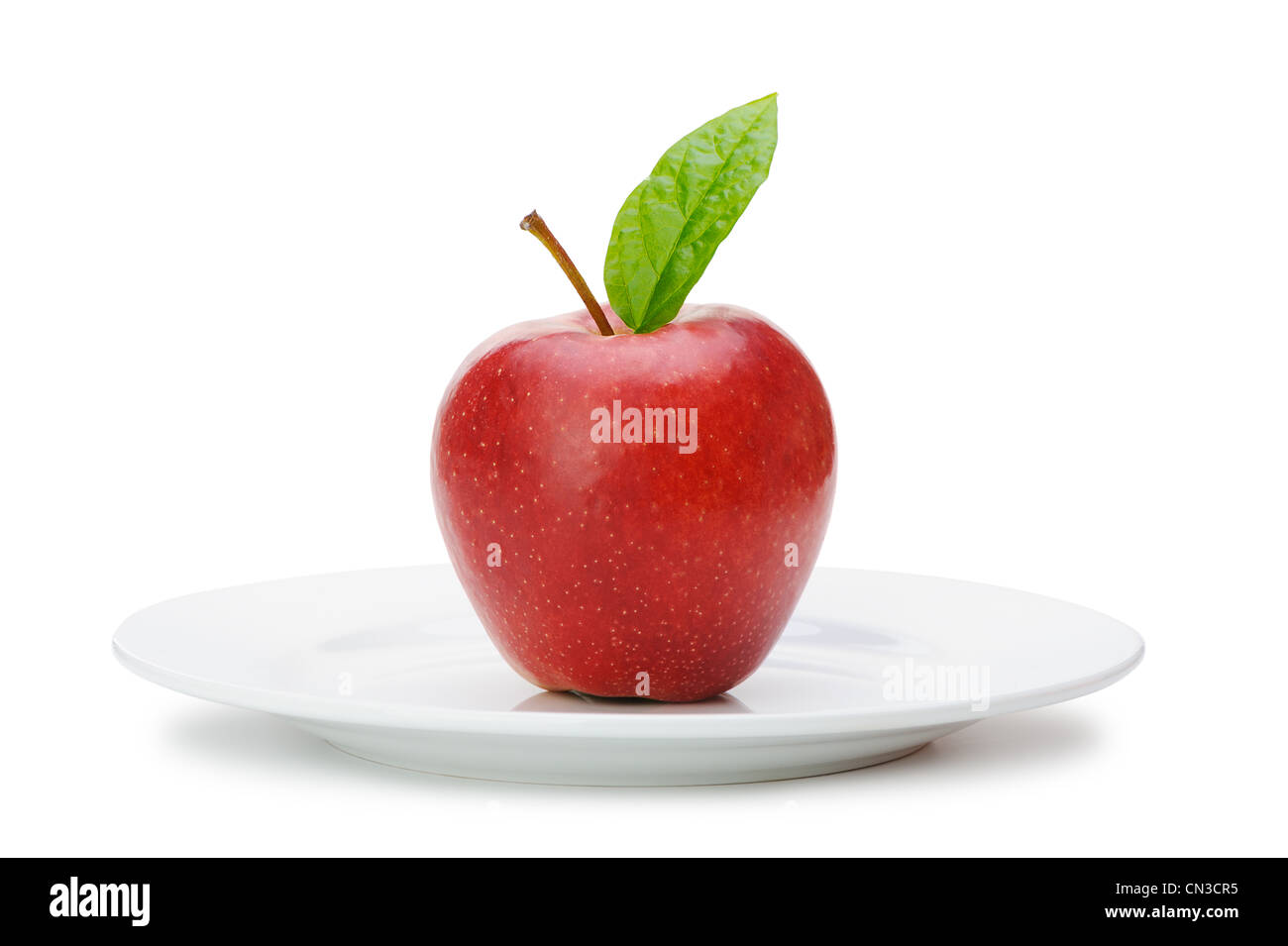 Red apple on plate. Isolated on white background Stock Photo - Alamy