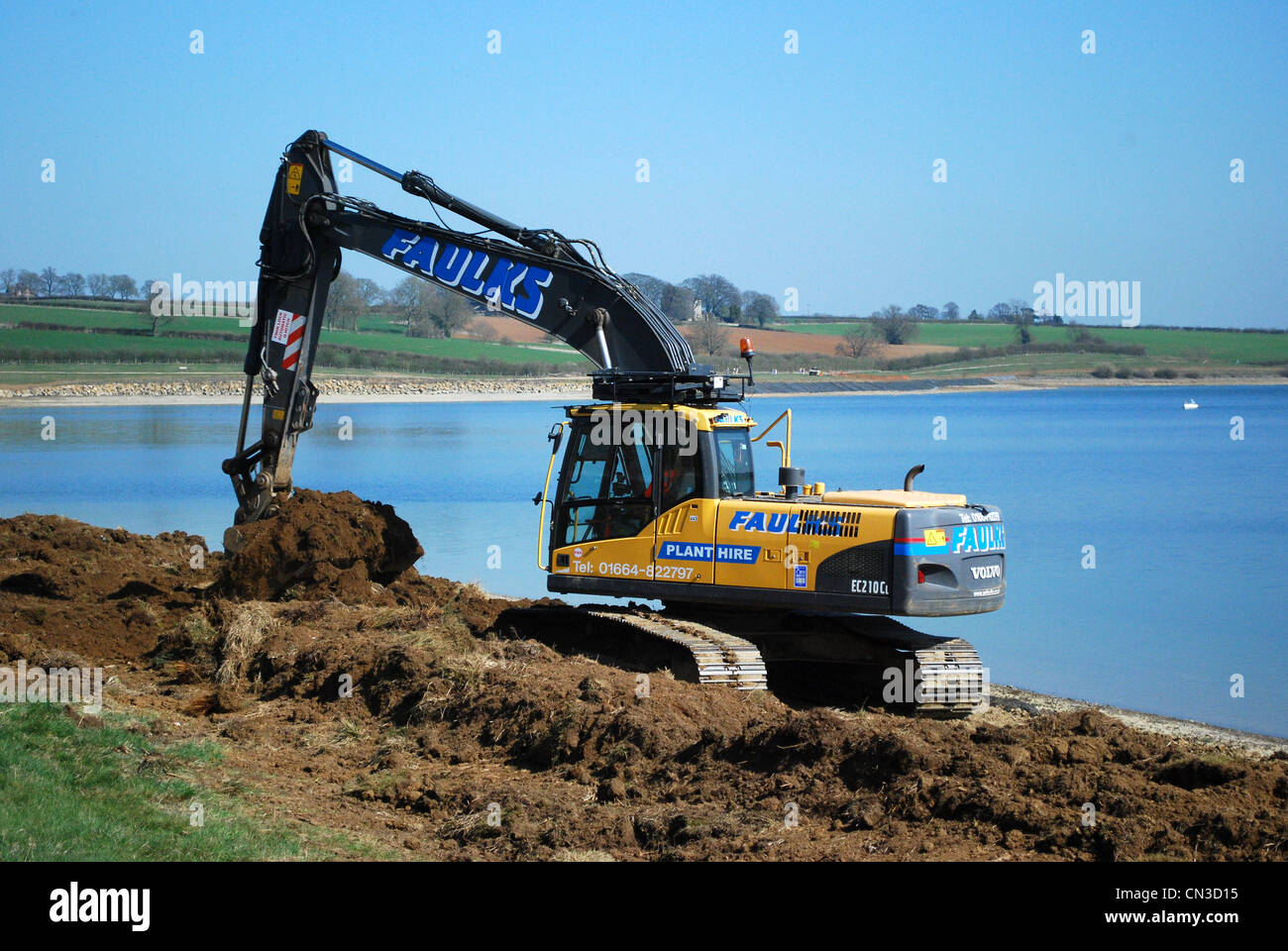 Mechanical digger outside Stock Photo - Alamy