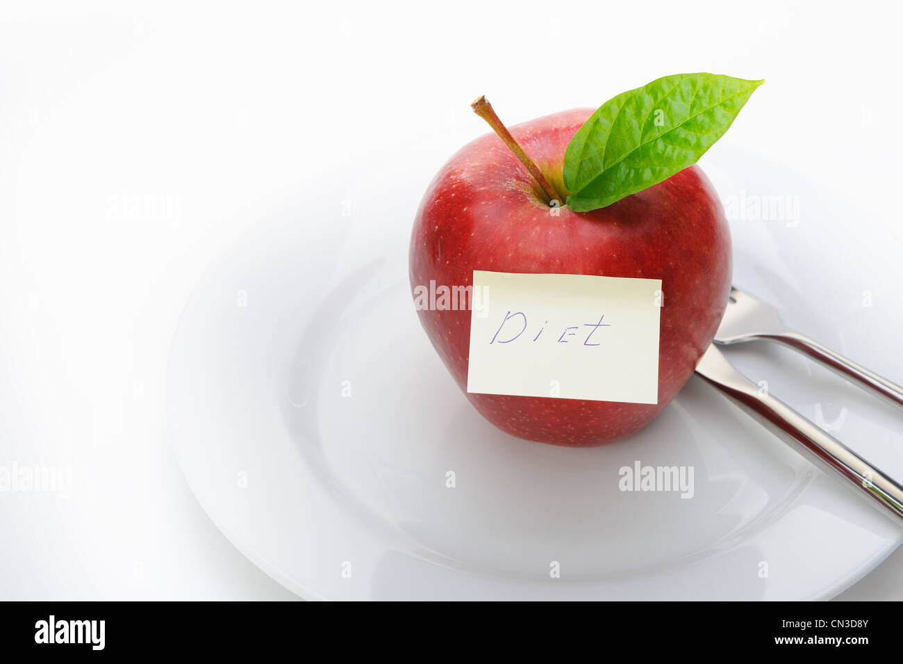 Apple with a paper note. Inscriptions on the notes diet. Fruit on a ...