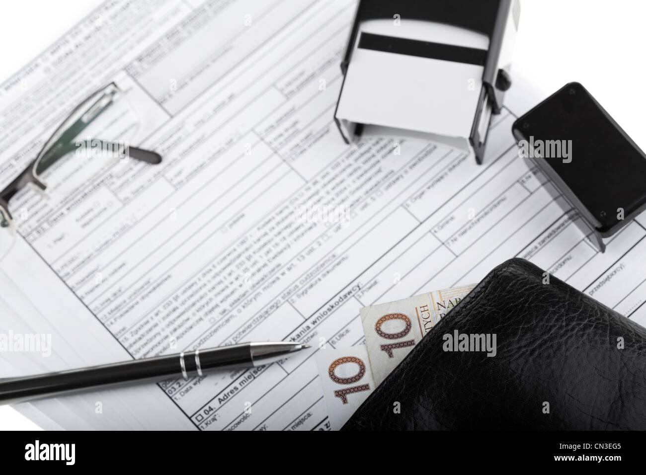 Business documents, wallet with polish paper money, pen, stamp and ...