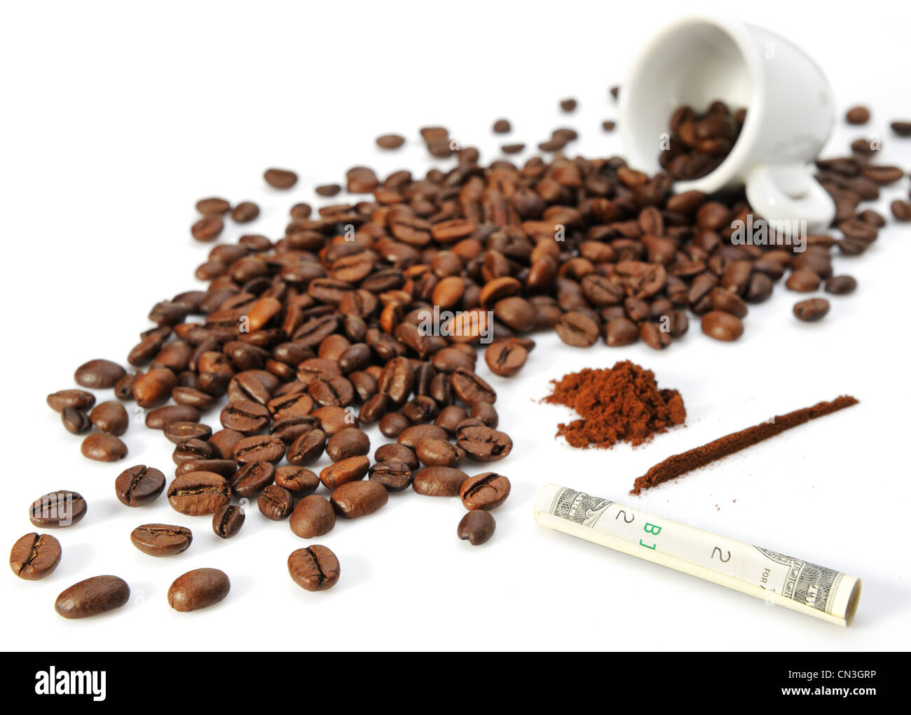 Coffee grains, a cup and twisted paper currency. Concept of coffee - a ...