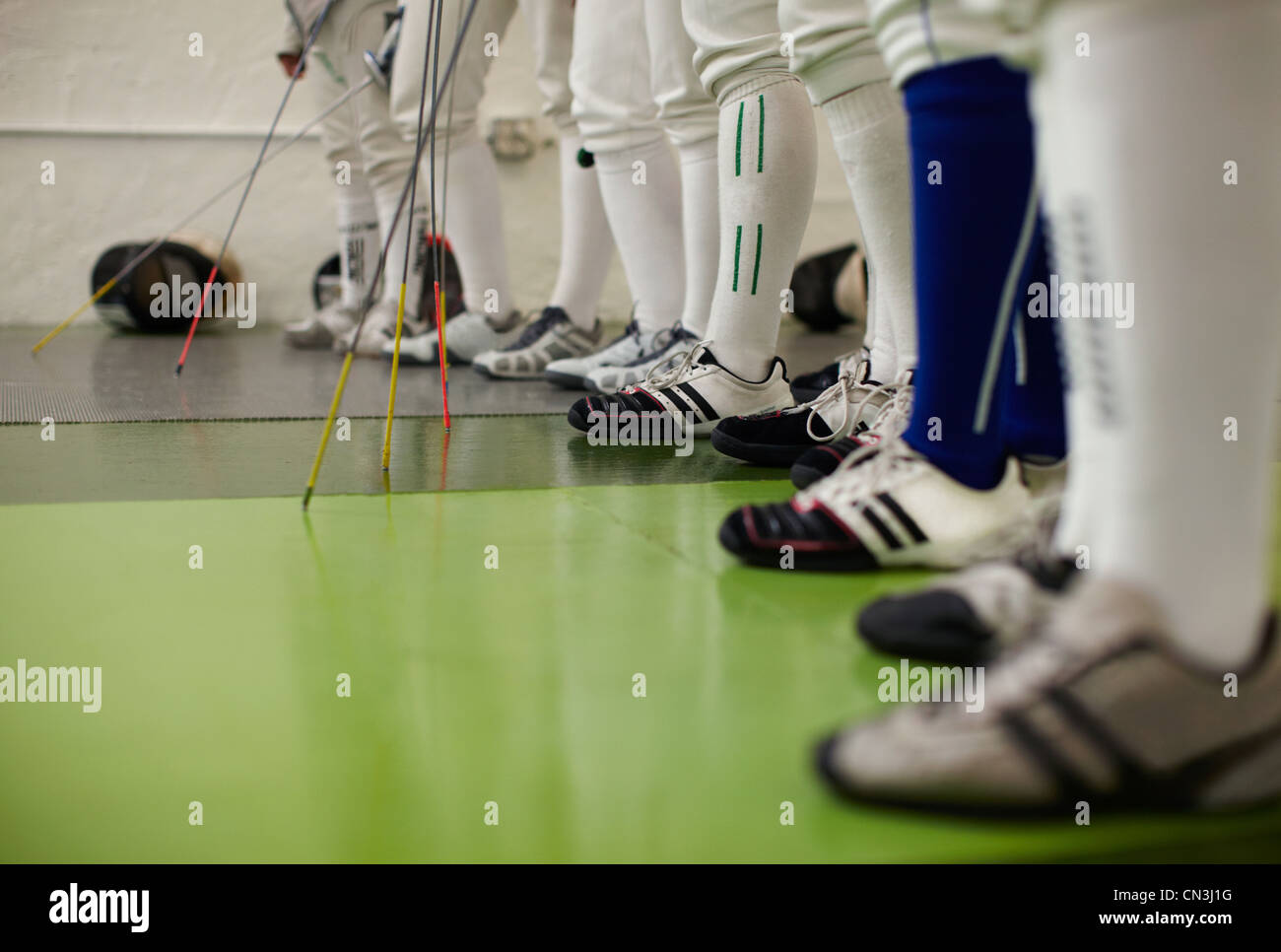 Female fencers standing together in a row, low section Stock Photo - Alamy