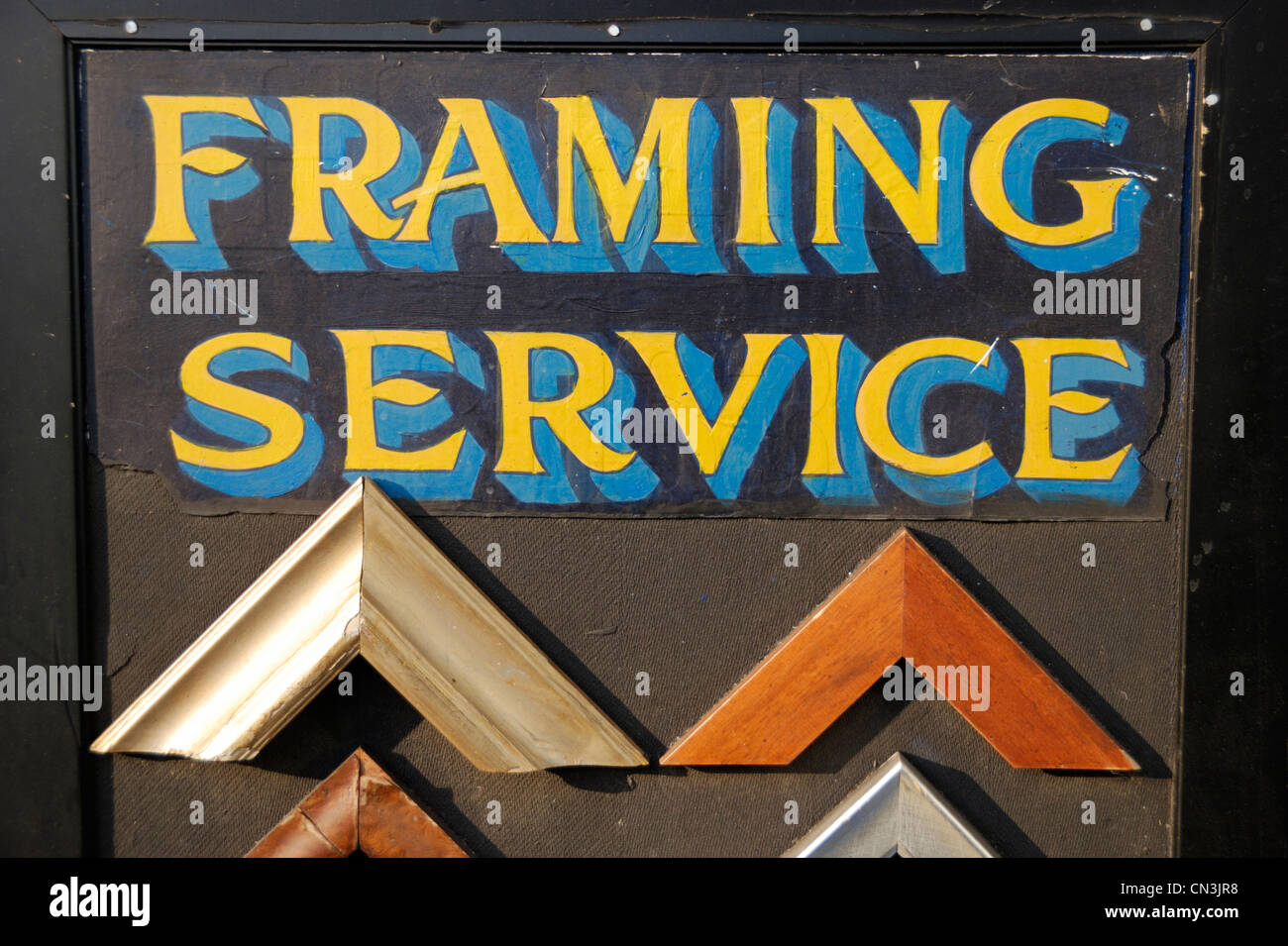 Framing Service ‘ sign outside a shop Stock Photo - Alamy
