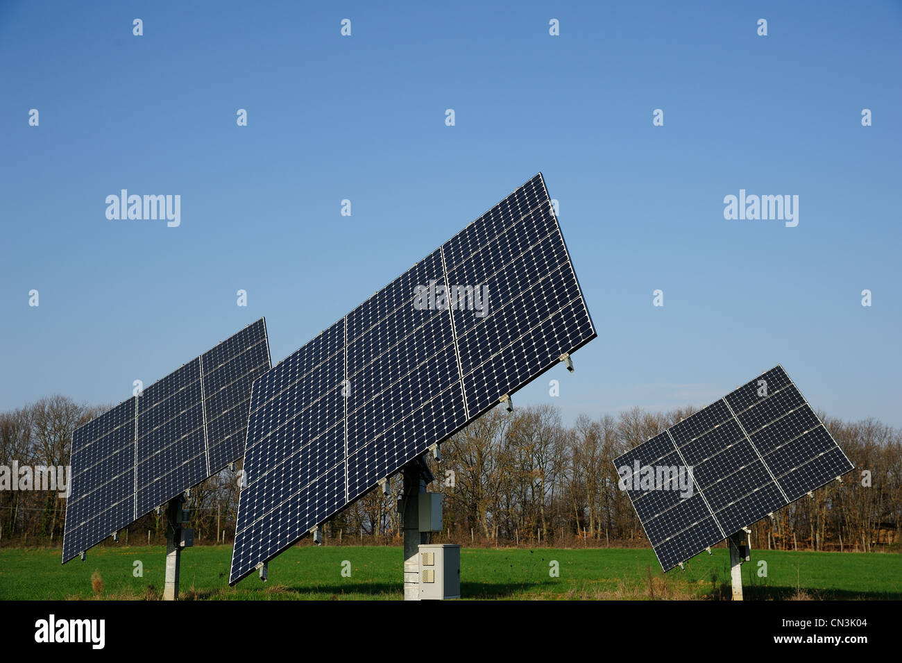 A group of solar panels in the green Stock Photo - Alamy