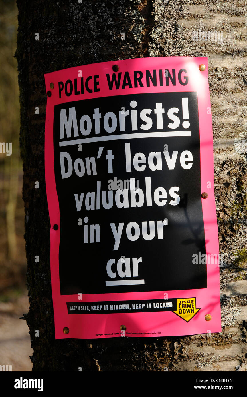 Police warning sign on a tree Stock Photo - Alamy