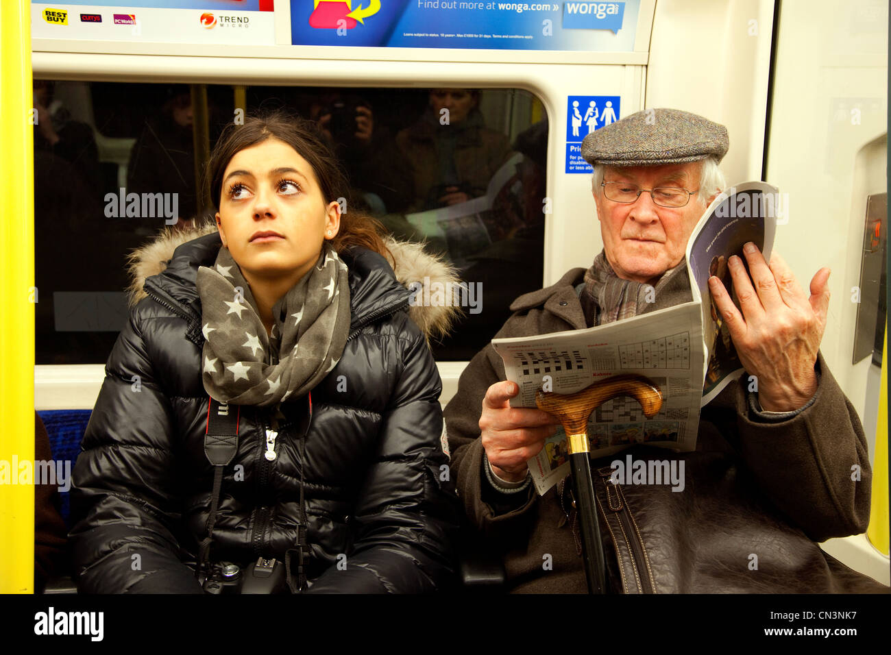 Underground london reading newspaper hi-res stock photography and ...