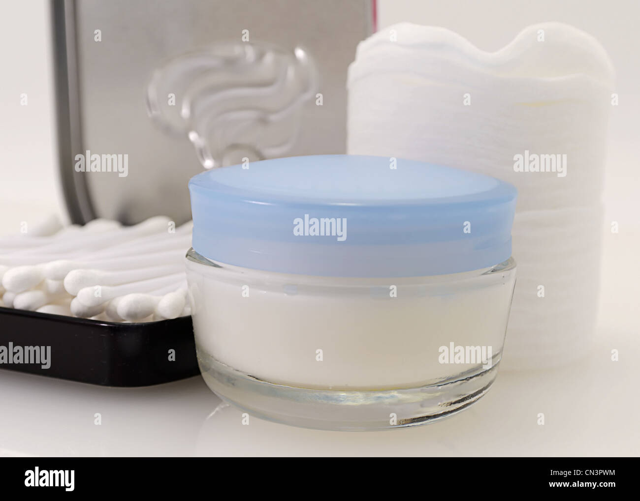 Cream and cotton pads and sticks hygiene Stock Photo - Alamy