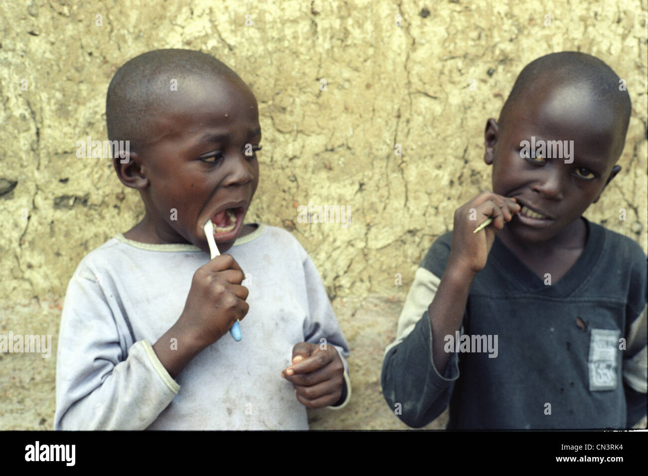 Two young african boys brushing teeth Stock Photo - Alamy
