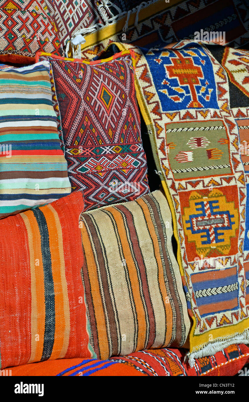 Bright rugs and cushions, Moroccan souk Stock Photo - Alamy