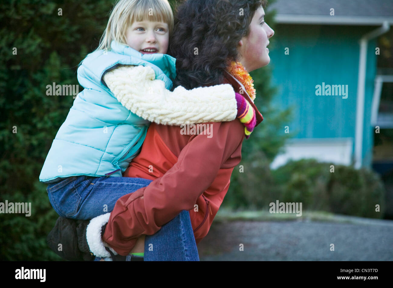 Teenage Girl Piggybacking Young Girl Stock Photo - Alamy