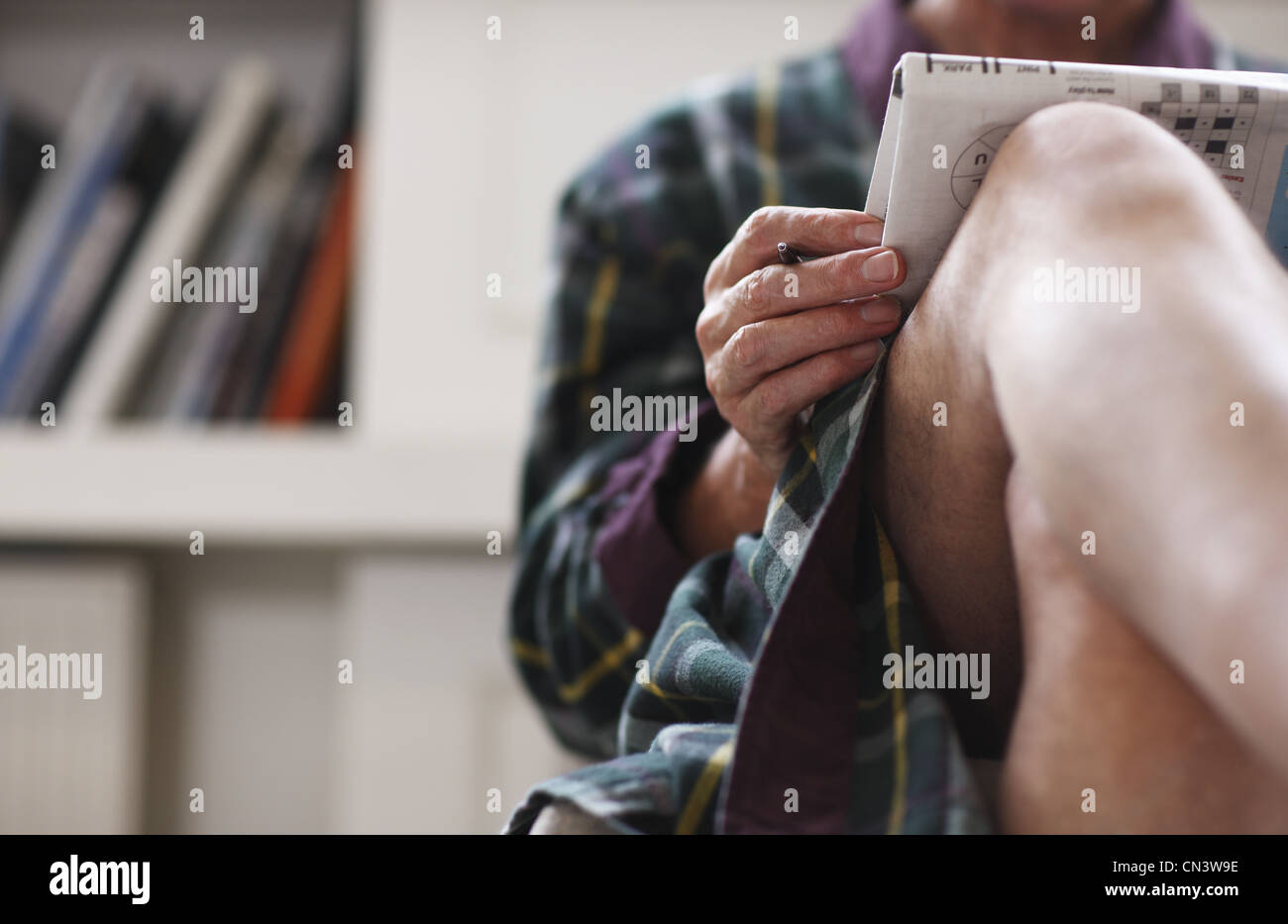 Man in robe reading newspaper hi-res stock photography and images - Alamy
