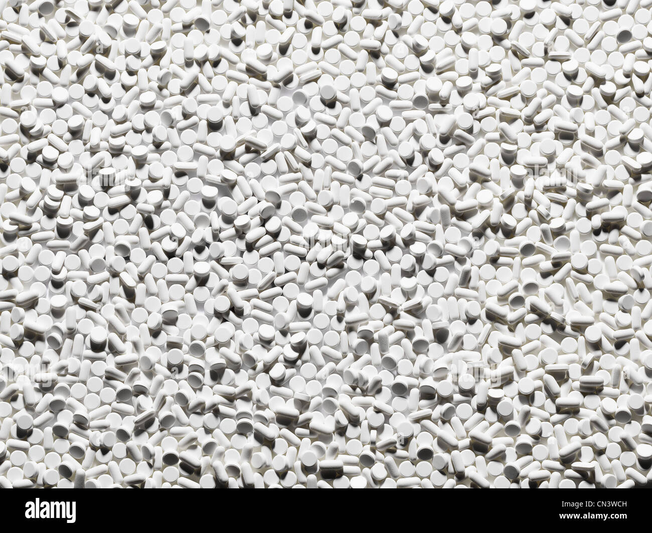 Large group of white tablets Stock Photo - Alamy