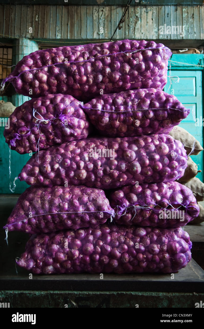 A stack of bags filled with onion Stock Photo - Alamy
