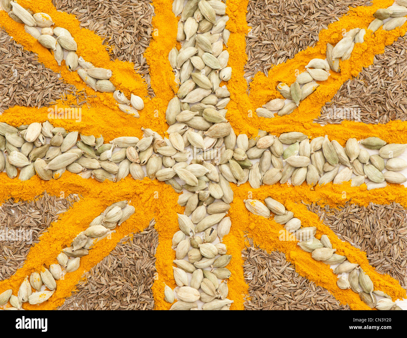 Union Flag created out of curry spices: whole cumin seeds, cardamom ...