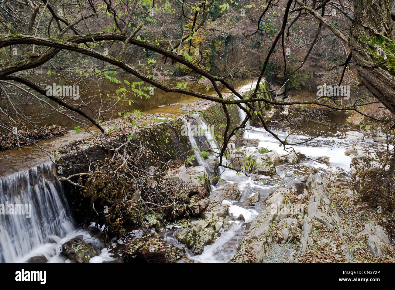 Artificial waterfall on the river Stock Photo - Alamy