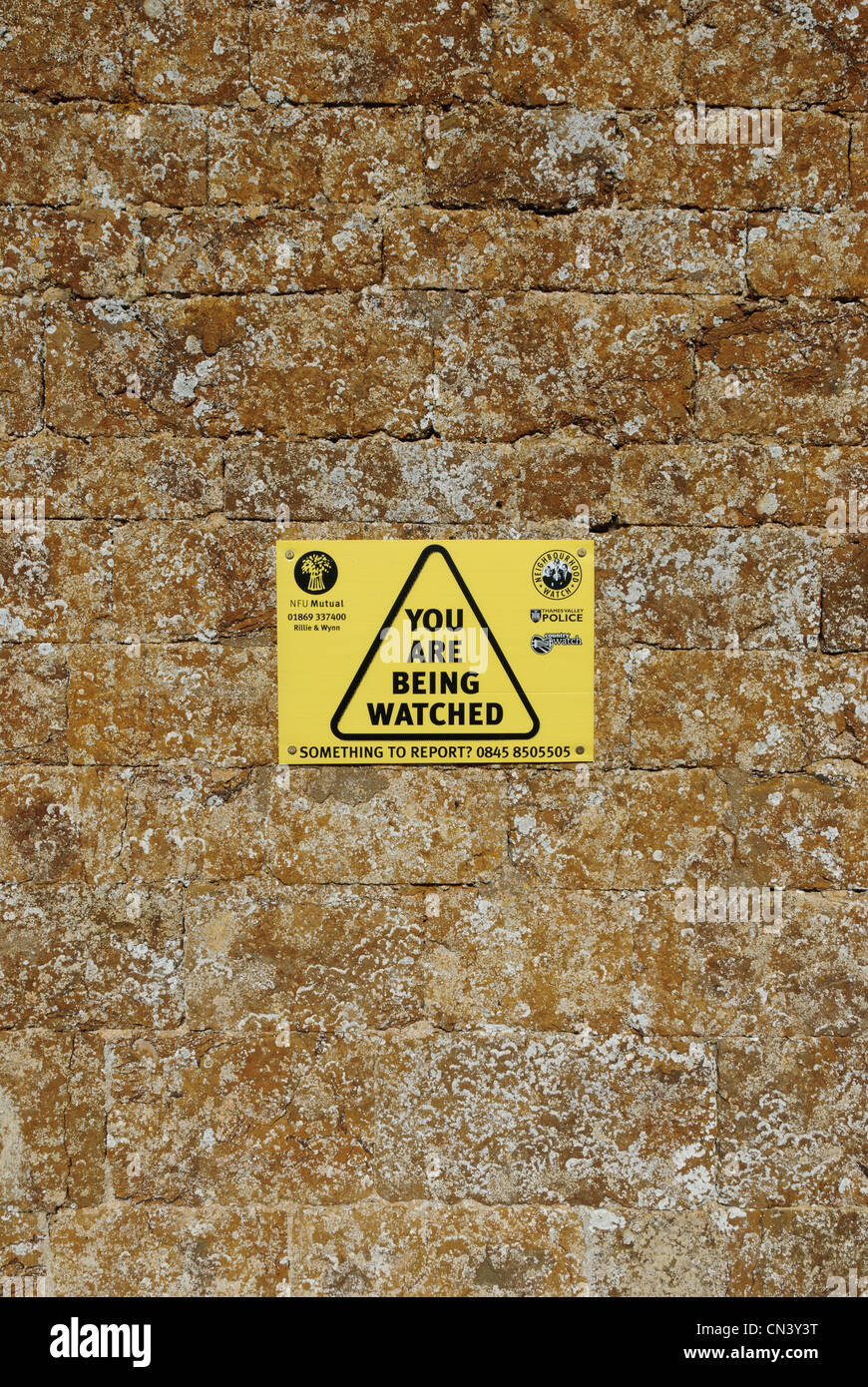 Neighbourhood Watch/Country Watch sign on the wall of St Peter ad ...